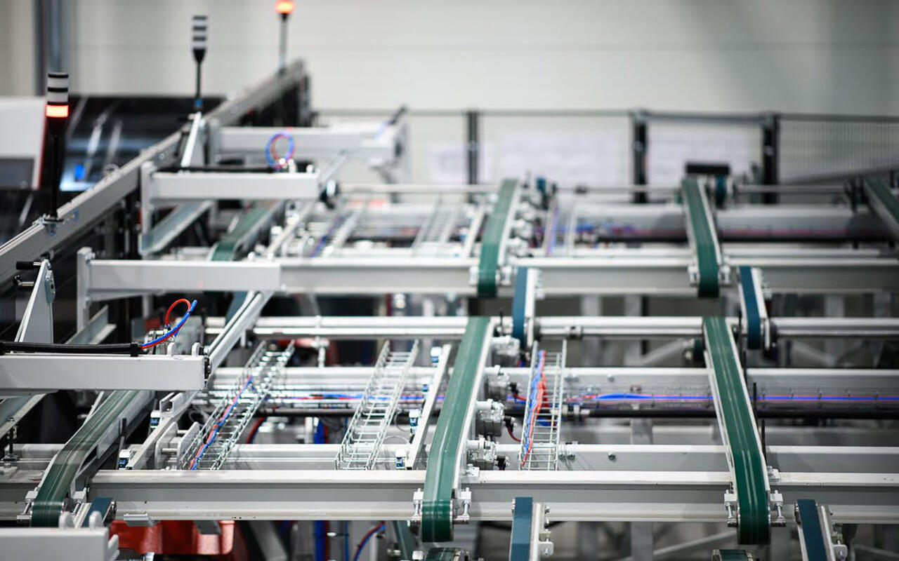 Barrus opens a factory costing 10 million